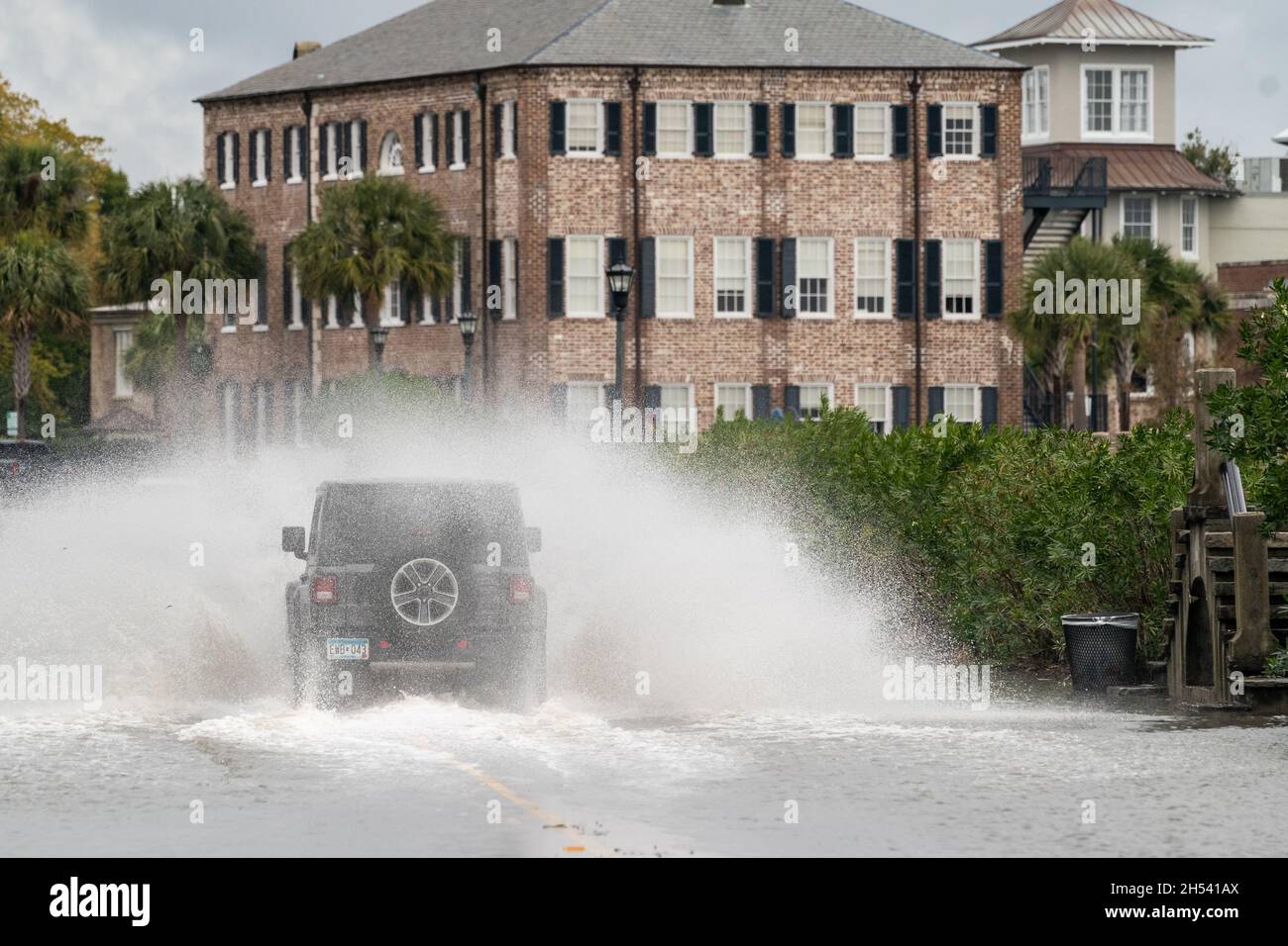 Charleston, United States. 06th Nov, 2022. Vehicles drive through flood ...