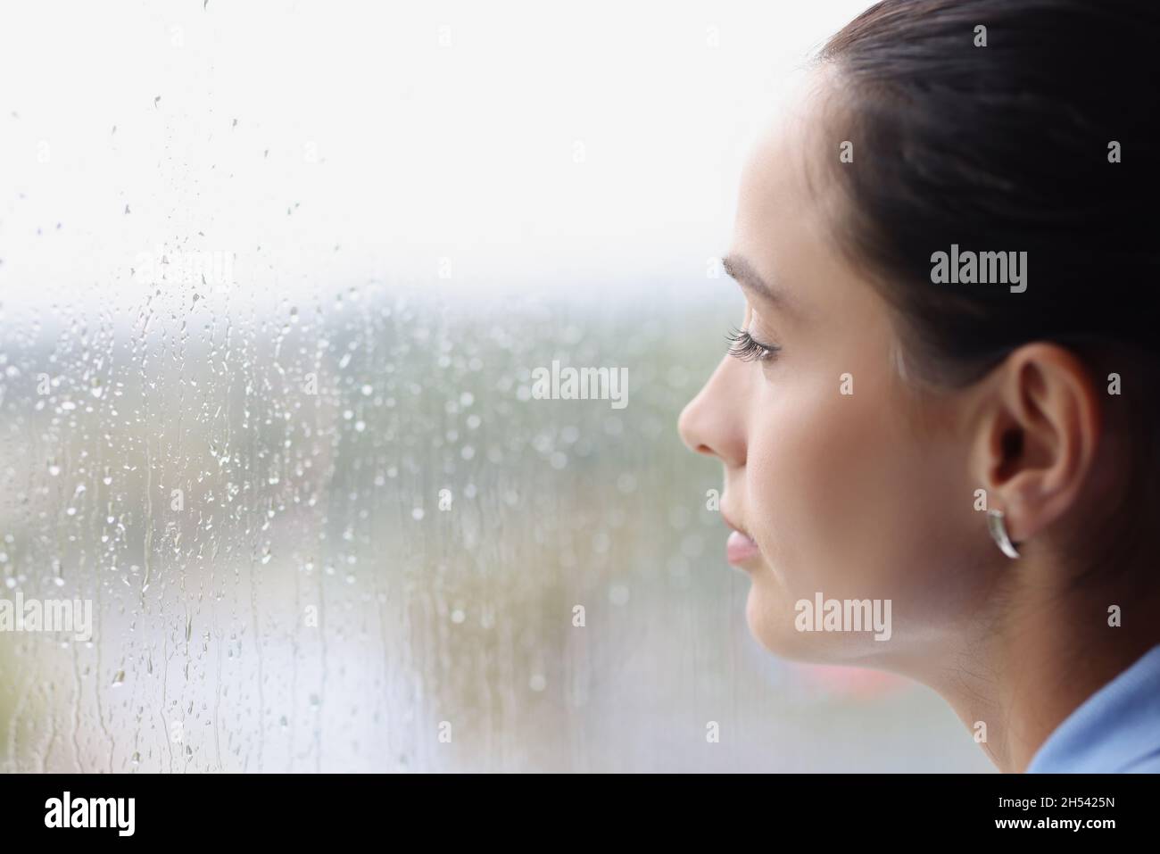 A Sad Girl Thinking In Rain