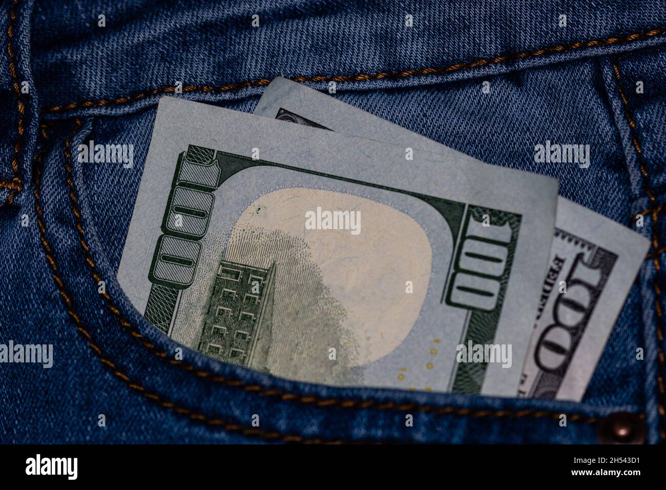 Closeup of dollars out of the jeans pocket - finance and currency ...