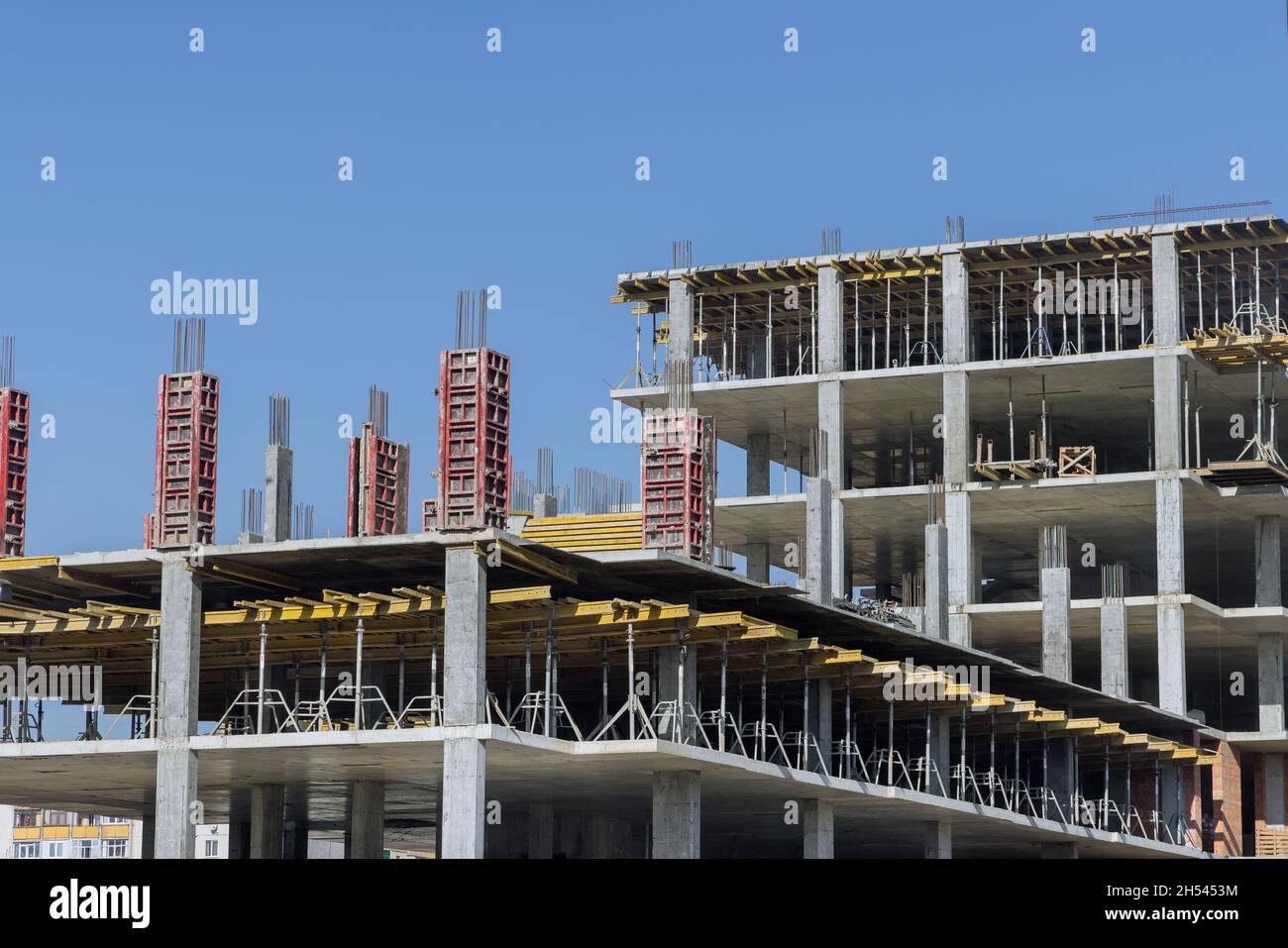 Construction of a multi-storey apartment building are work along the ...