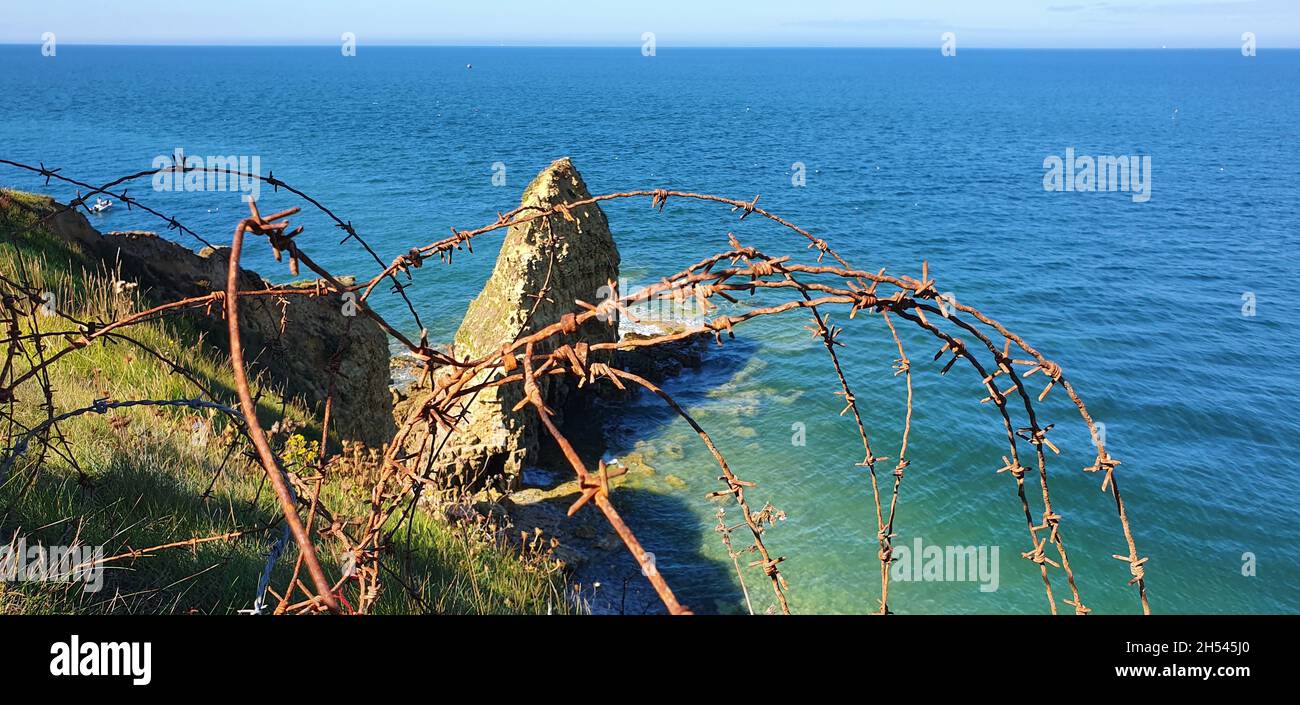 Close-up shot rusty barbed wire on beautiful seashore background Stock ...
