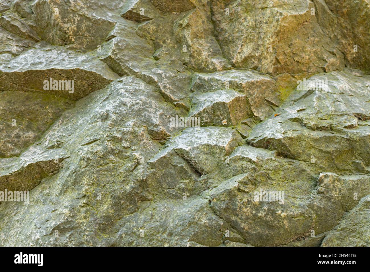 Destruction of the rock of the mountain after the explosion. Cracks in ...