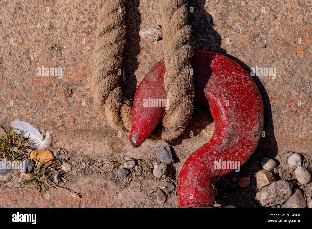 A red securing Metal Hook and rope - Charlestown, Cornwall, UK Stock ...