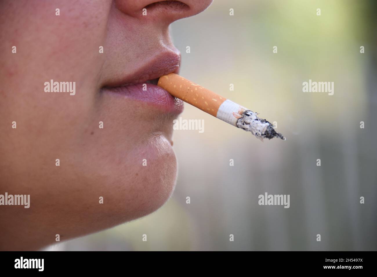 Beautiful woman smoking cigarette hi-res stock photography and images ...