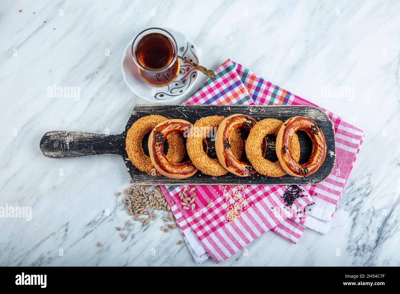 Turkish Bagel Kandil simiti with tea (stack of pastry). A savory, ring ...