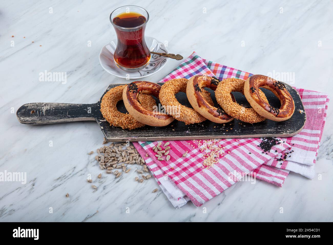 Turkish Bagel Kandil simiti with tea (stack of pastry). A savory, ring ...