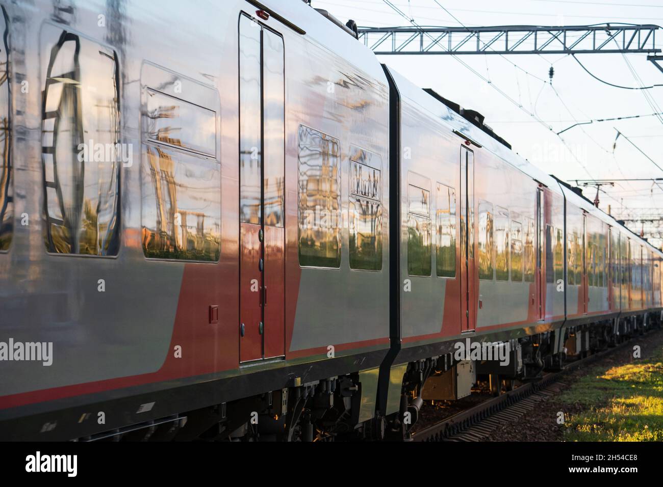 Train arrival: outside view of modern compartment carriage for suburban ...