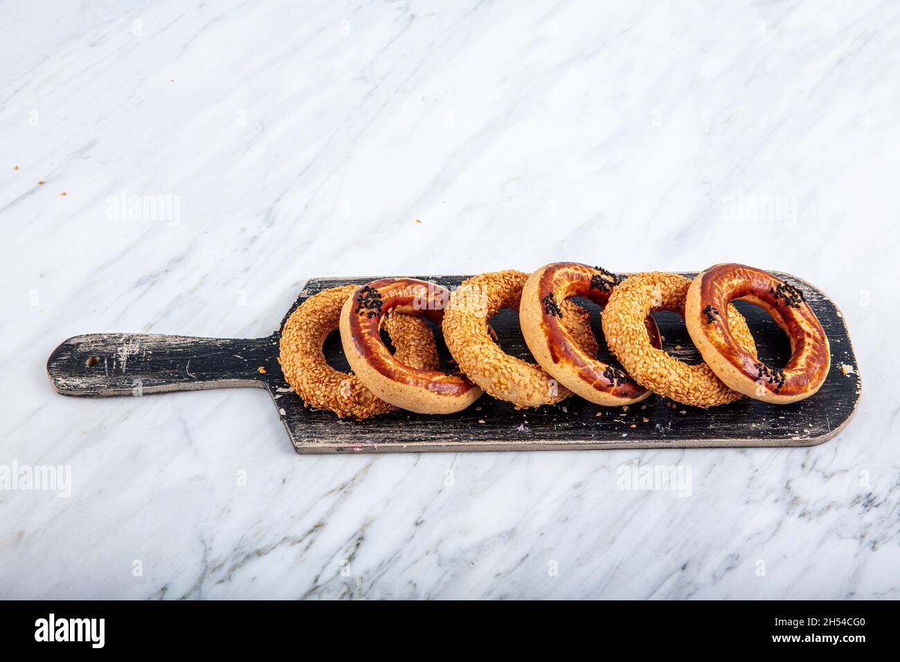 Turkish Bagel Kandil simiti with tea (stack of pastry). A savory, ring ...
