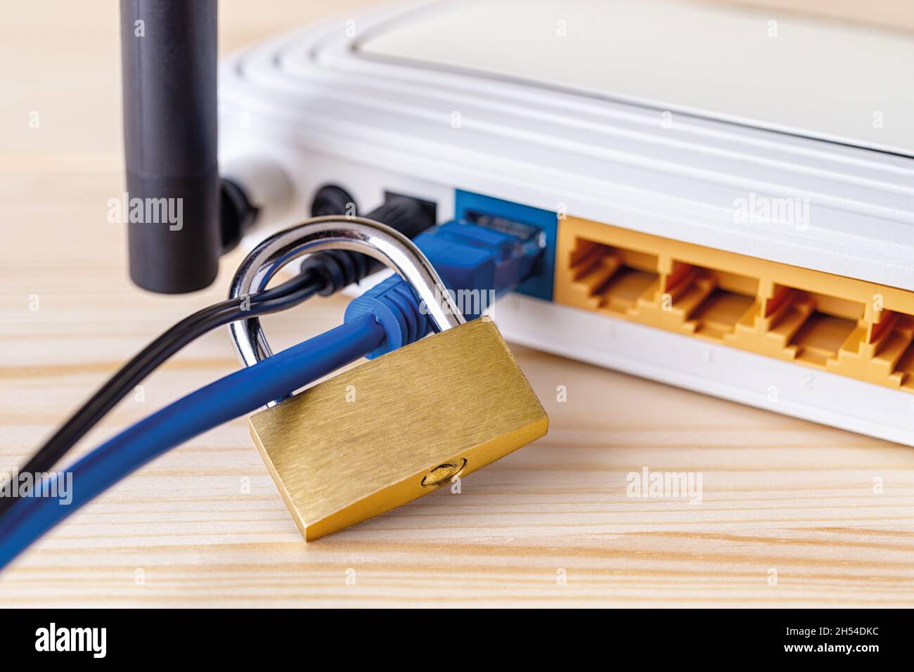 Close-up of metal padlock locked blue network cable of Wi-Fi wireless ...