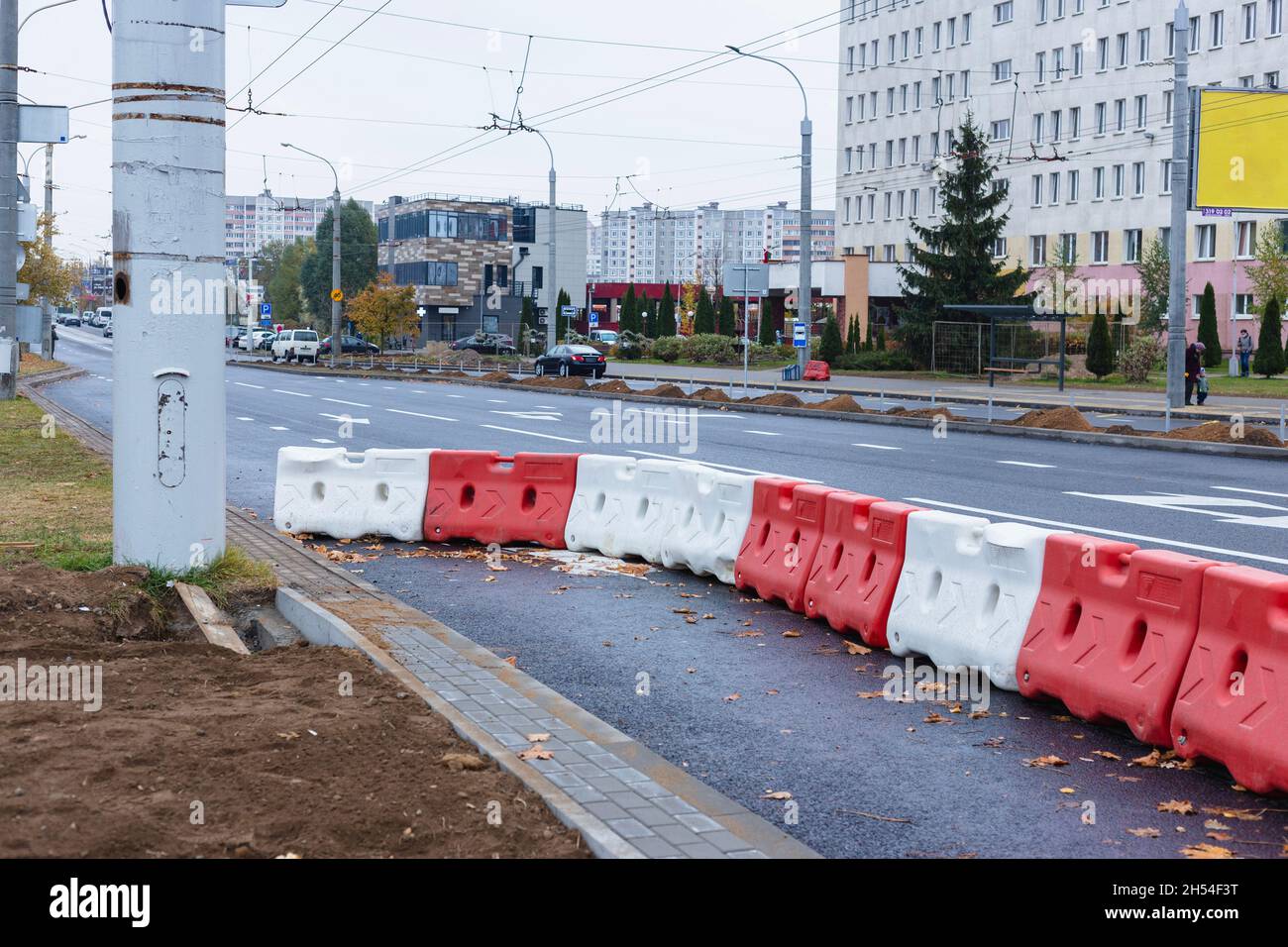 Red and white plastic road barriers. Construction props Stock Photo - Alamy