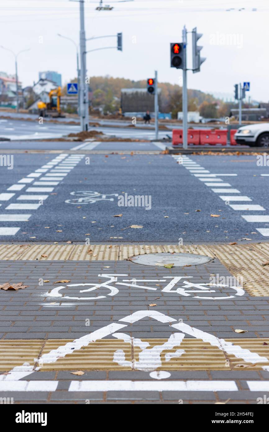 Bicycle path passing through the pedestrian crossing Stock Photo - Alamy