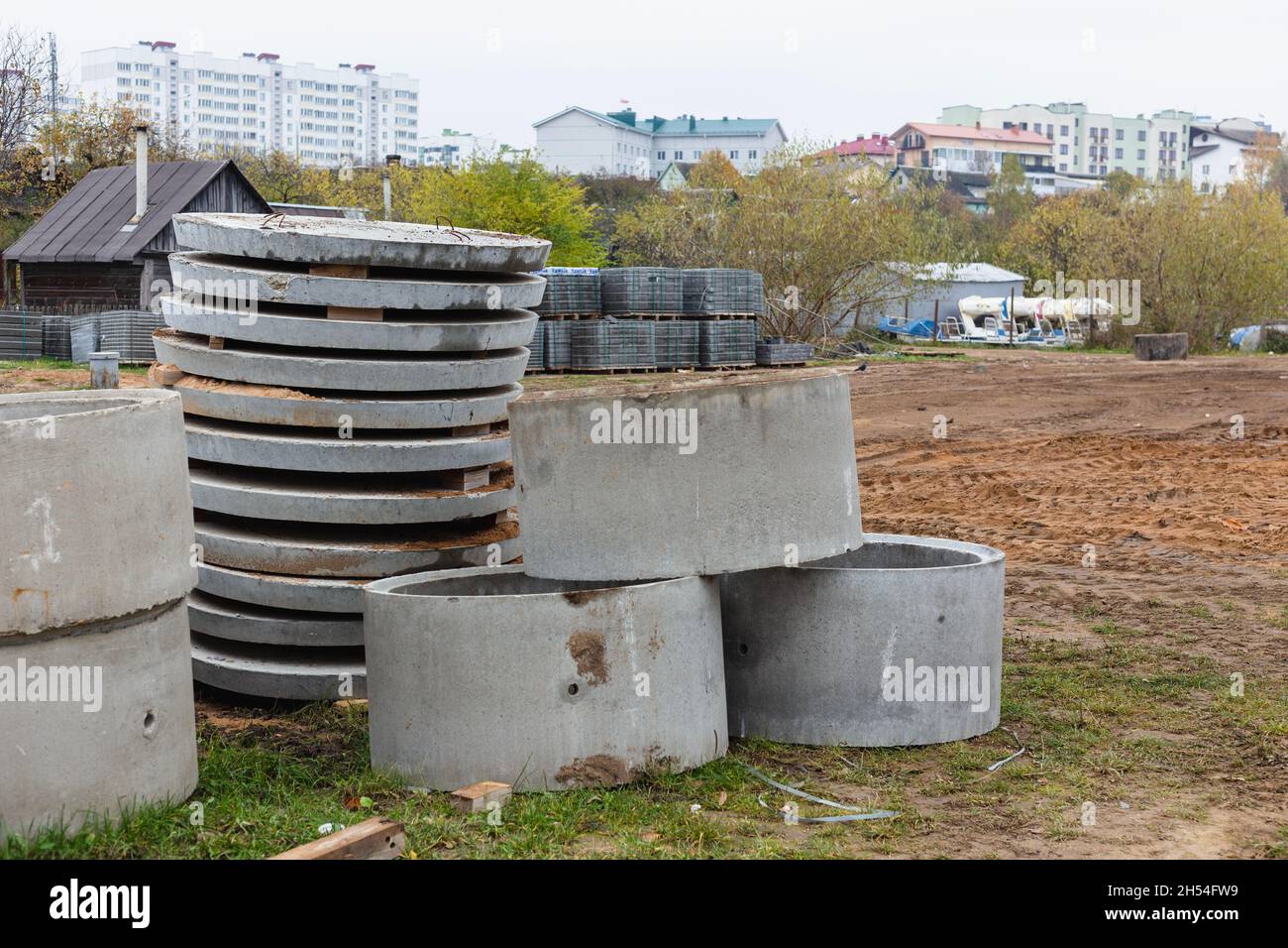 Concrete well rings and slabs at construction site Stock Photo - Alamy