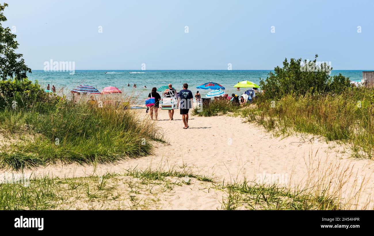 Sauble Beach, Ontario, Canada - August 5, 2021: People entering beach ...