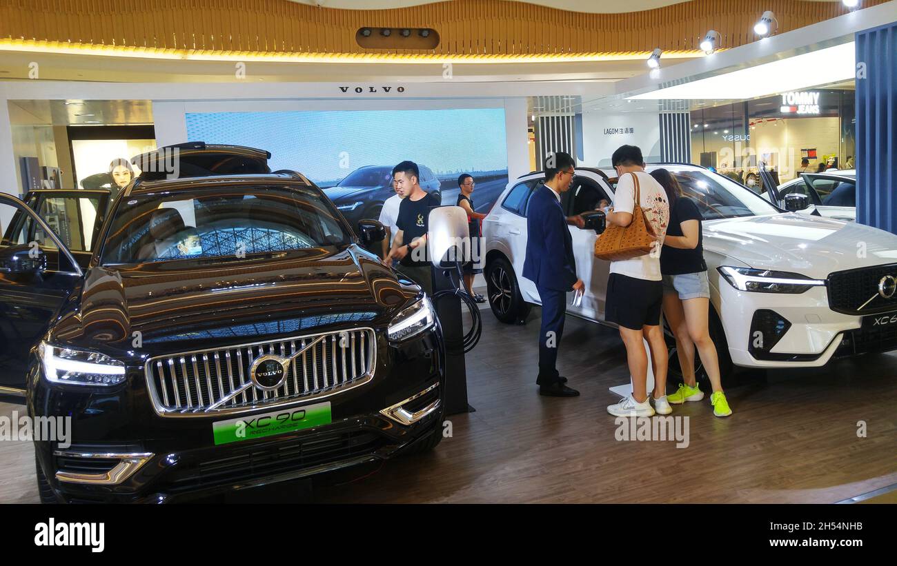 Shenzhen, China: car exhibition, young men and women watching newly ...