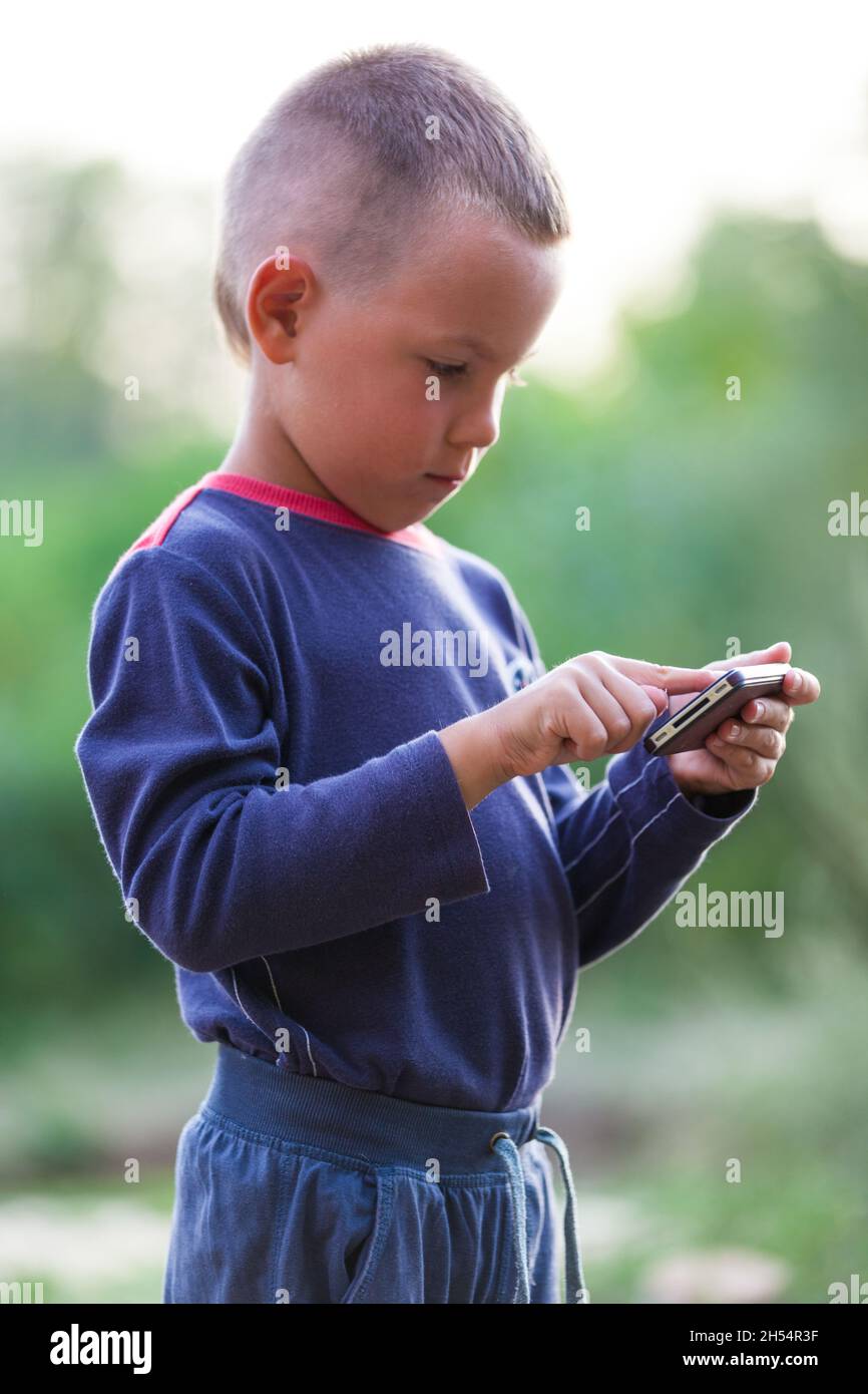 Child using a mobile phone Stock Photo - Alamy