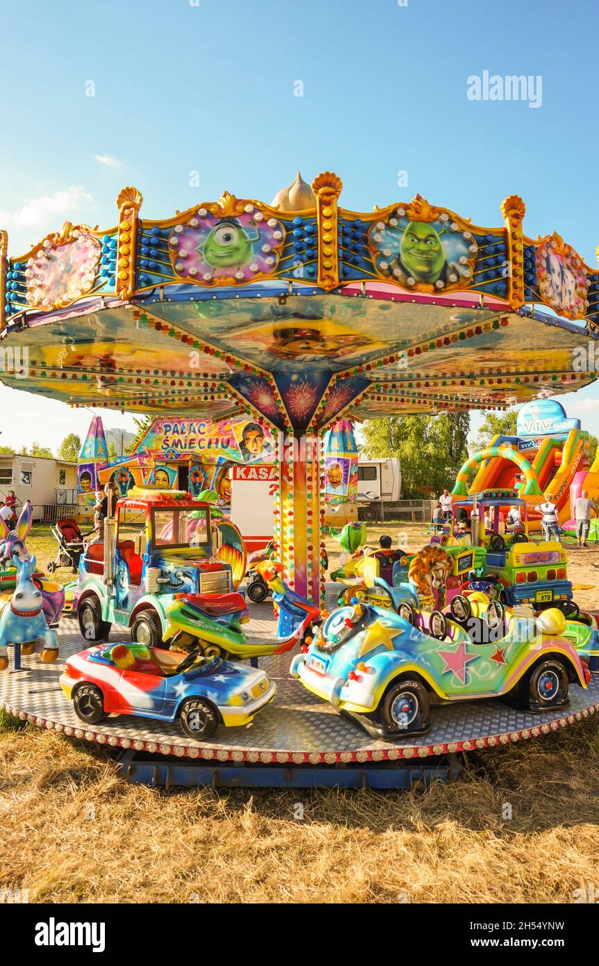 POZNAN, POLAND - May 22, 2016: A colorful carousel attraction with ...