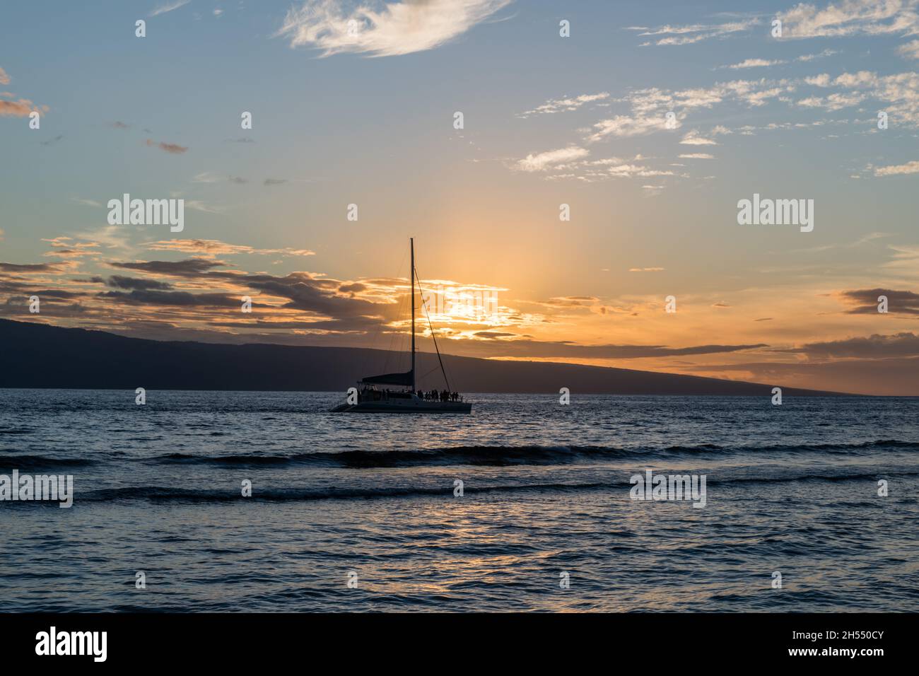 Beautiful Maui sunset with sun setting behind Lanai, Hawaii Stock Photo ...