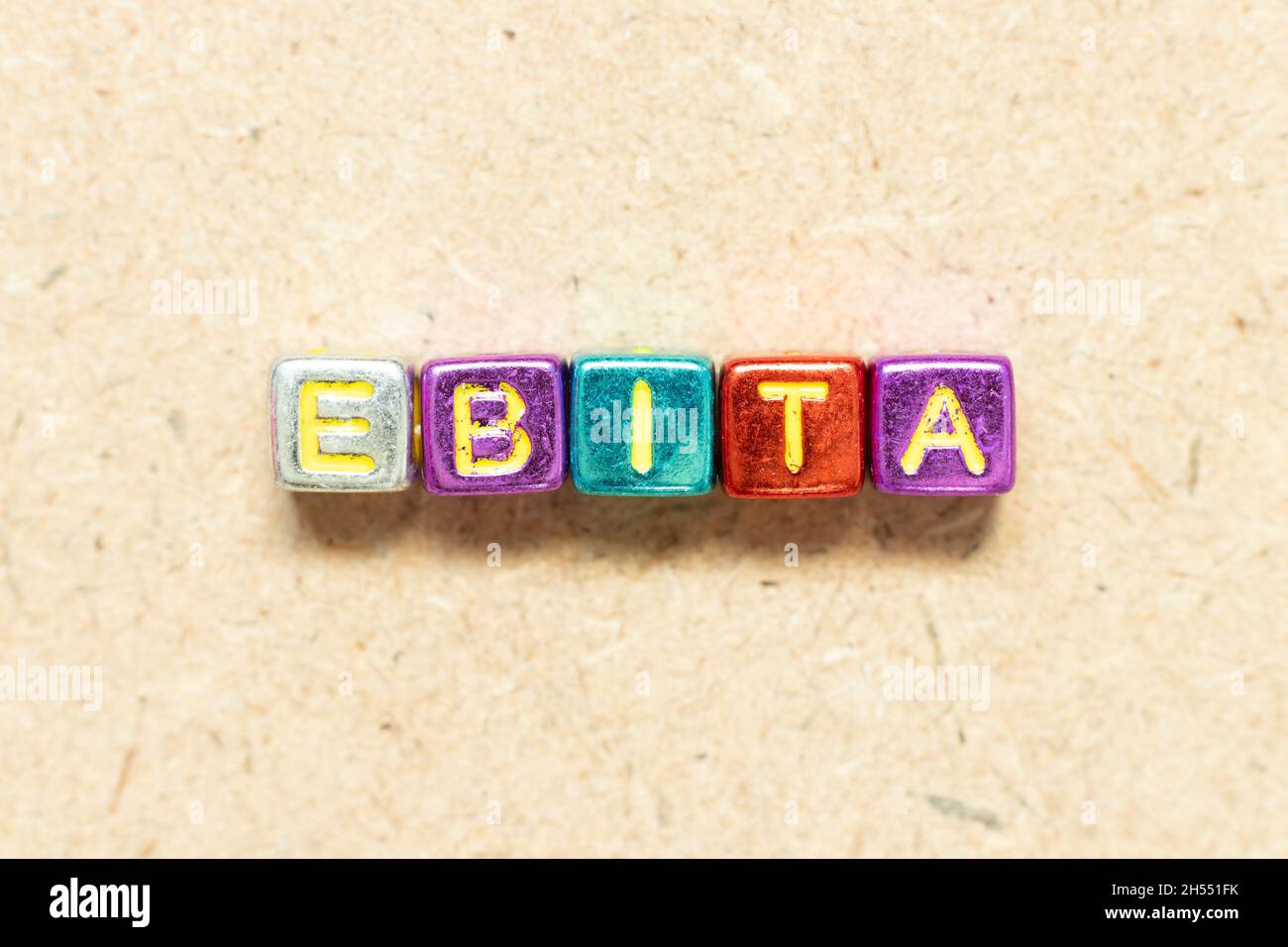Metallic color alphabet letter block in word EBITA (abbreviation of ...