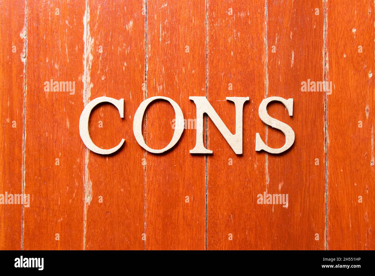 Alphabet letter in word cons on old red color wood plate background ...