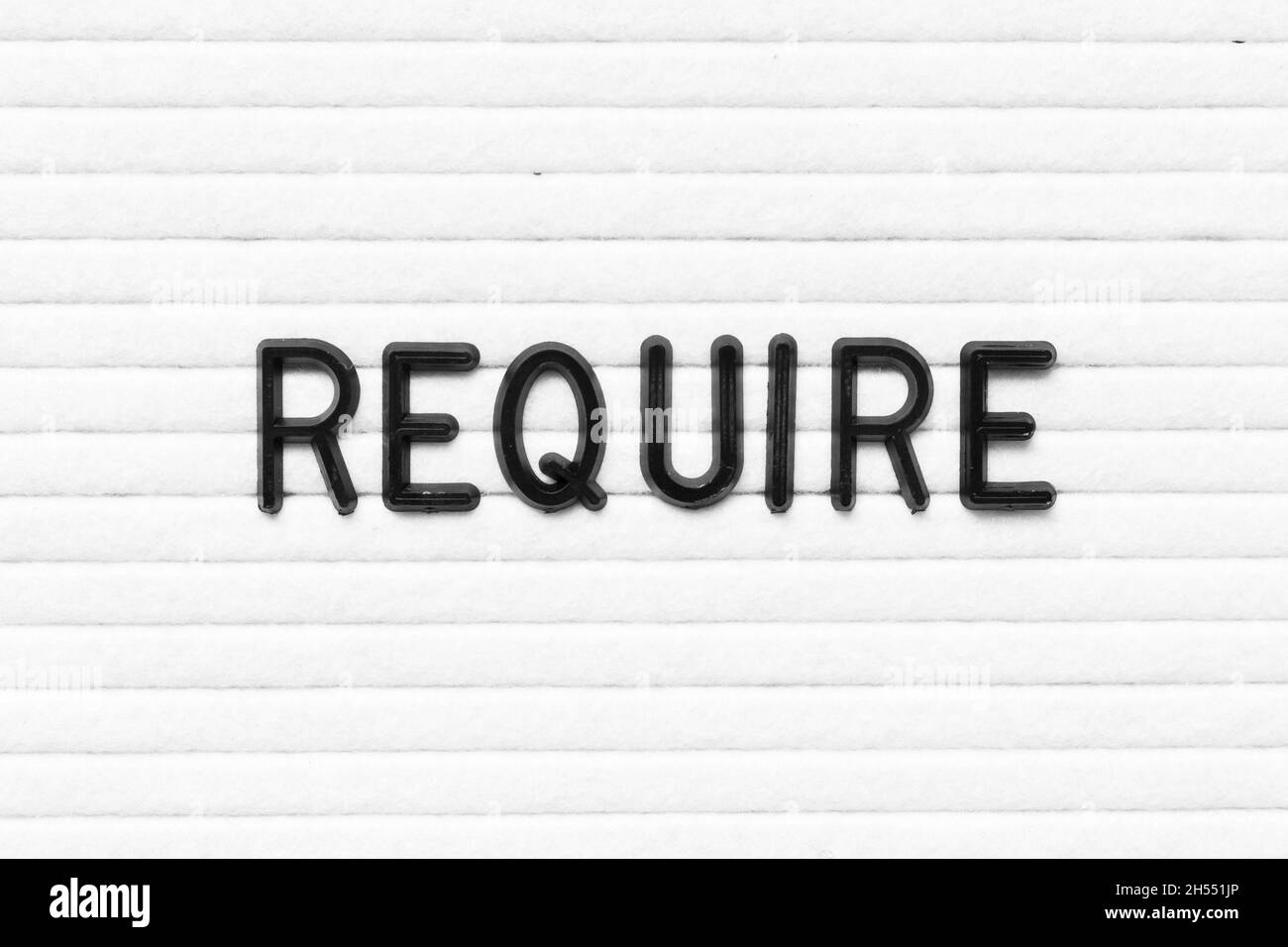 Black letter in word require on white felt board background Stock Photo ...
