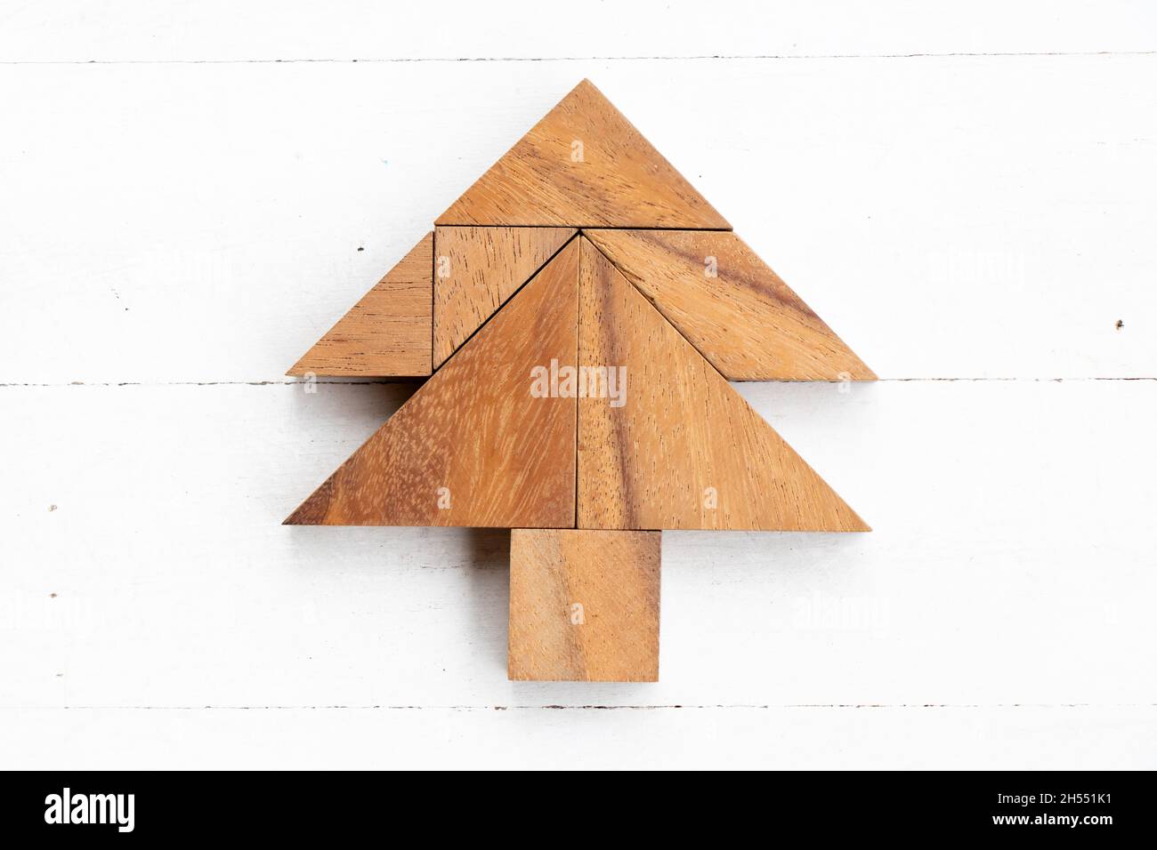 Wood tangram puzzle in Pine or christmas tree shape on white wood ...