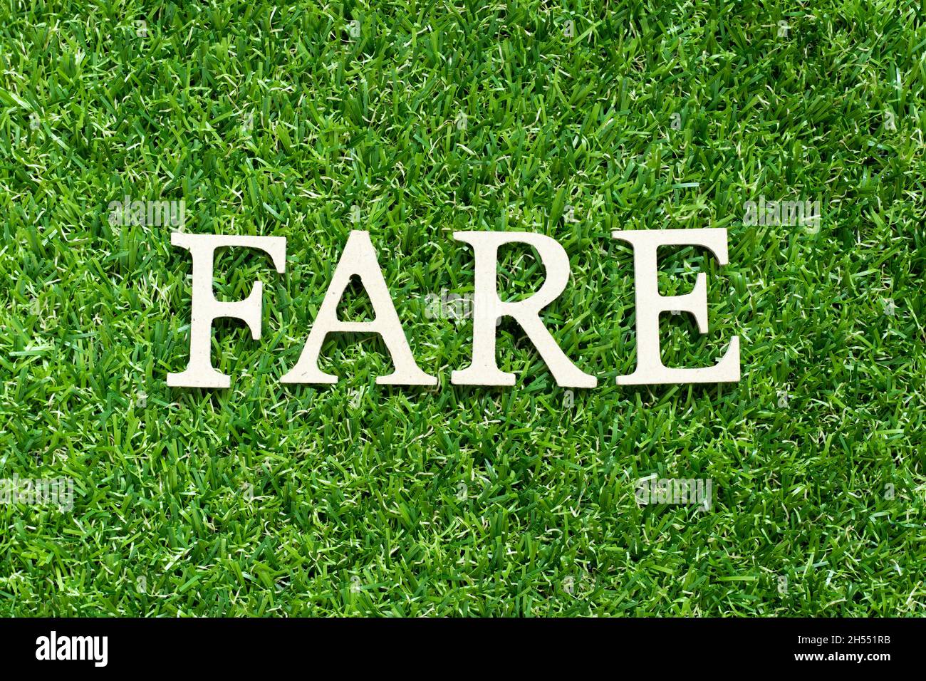 Alphabet letter in word fare on green grass background Stock Photo - Alamy