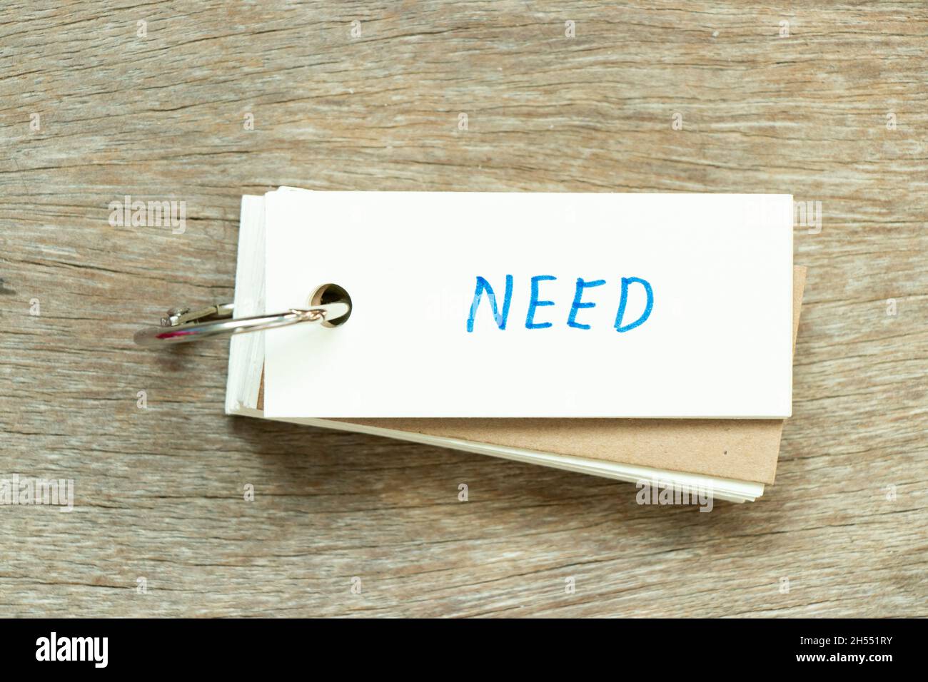 Flash card with handwriting word need on wood background Stock Photo ...