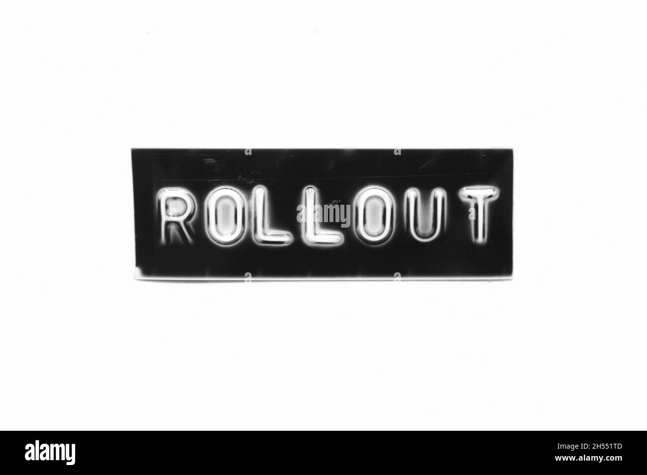 Black color banner that have embossed letter with word rollout on white ...