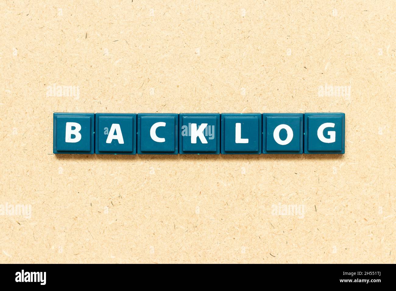 Tile alphabet letter in word backlog on wood background Stock Photo - Alamy