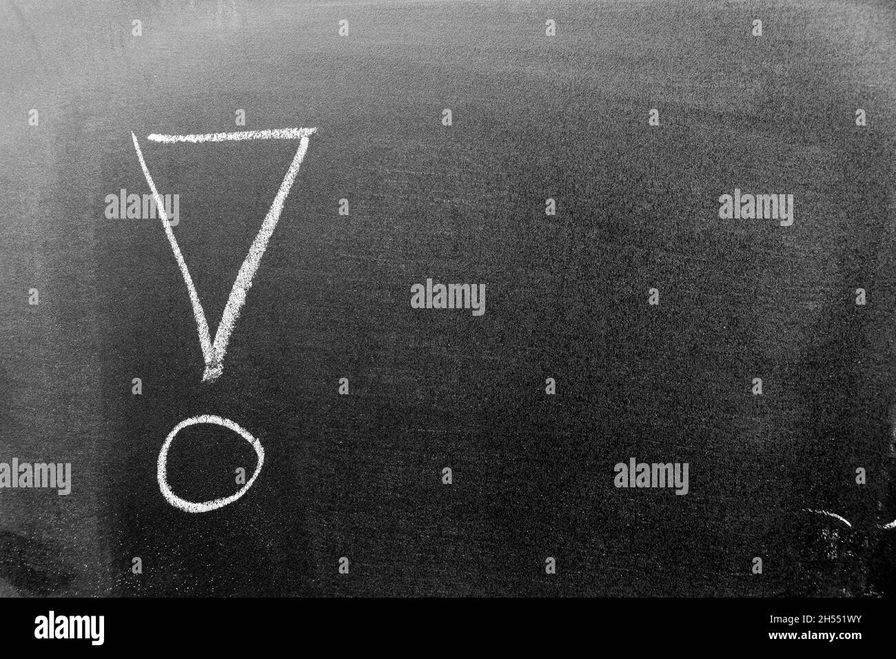 White color chalk hand drawing in exclamation mark shape with copy ...
