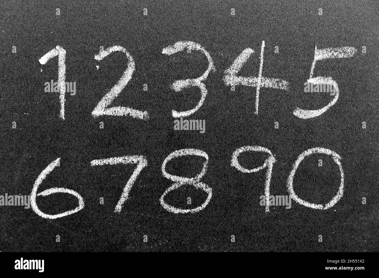White color chalk hand drawing in number 0 - 9 shape on blackboard ...