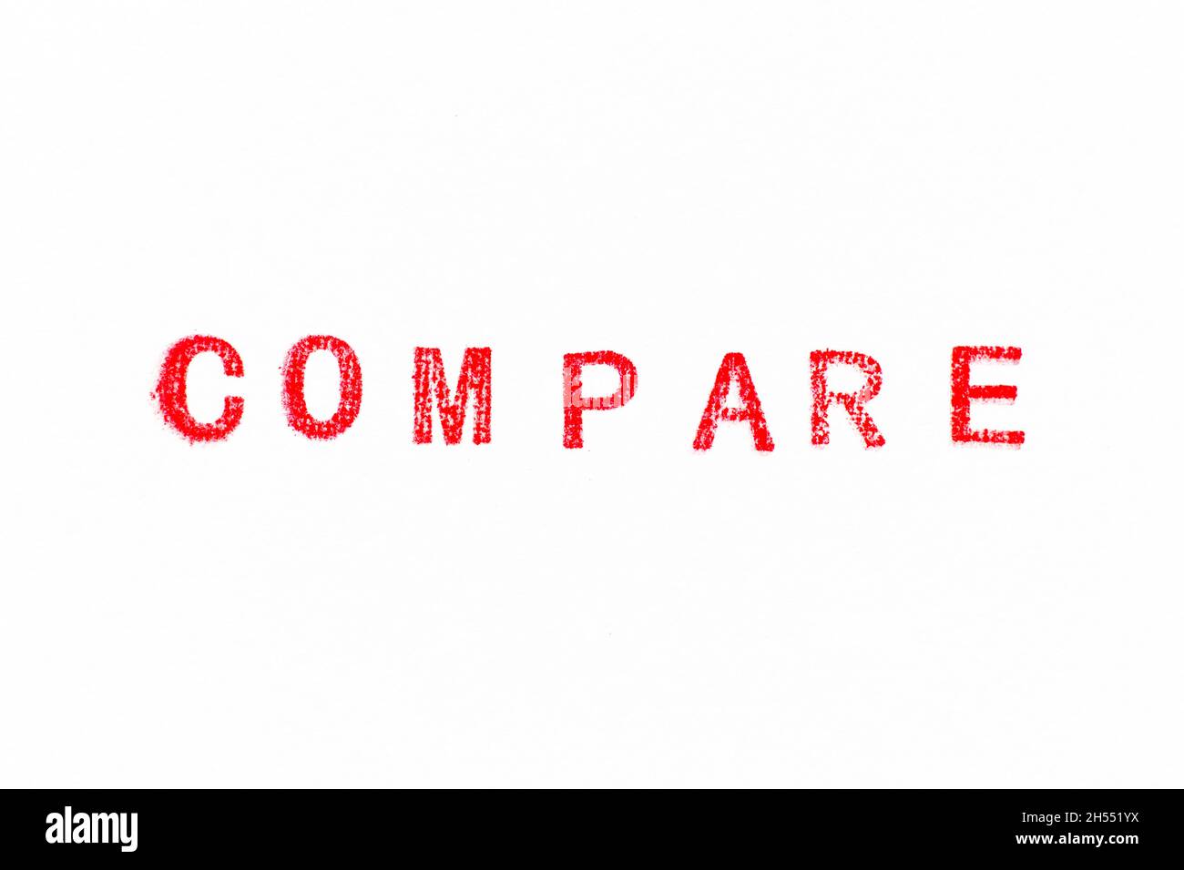 Red color rubber stamp in word compare on white paper background Stock ...