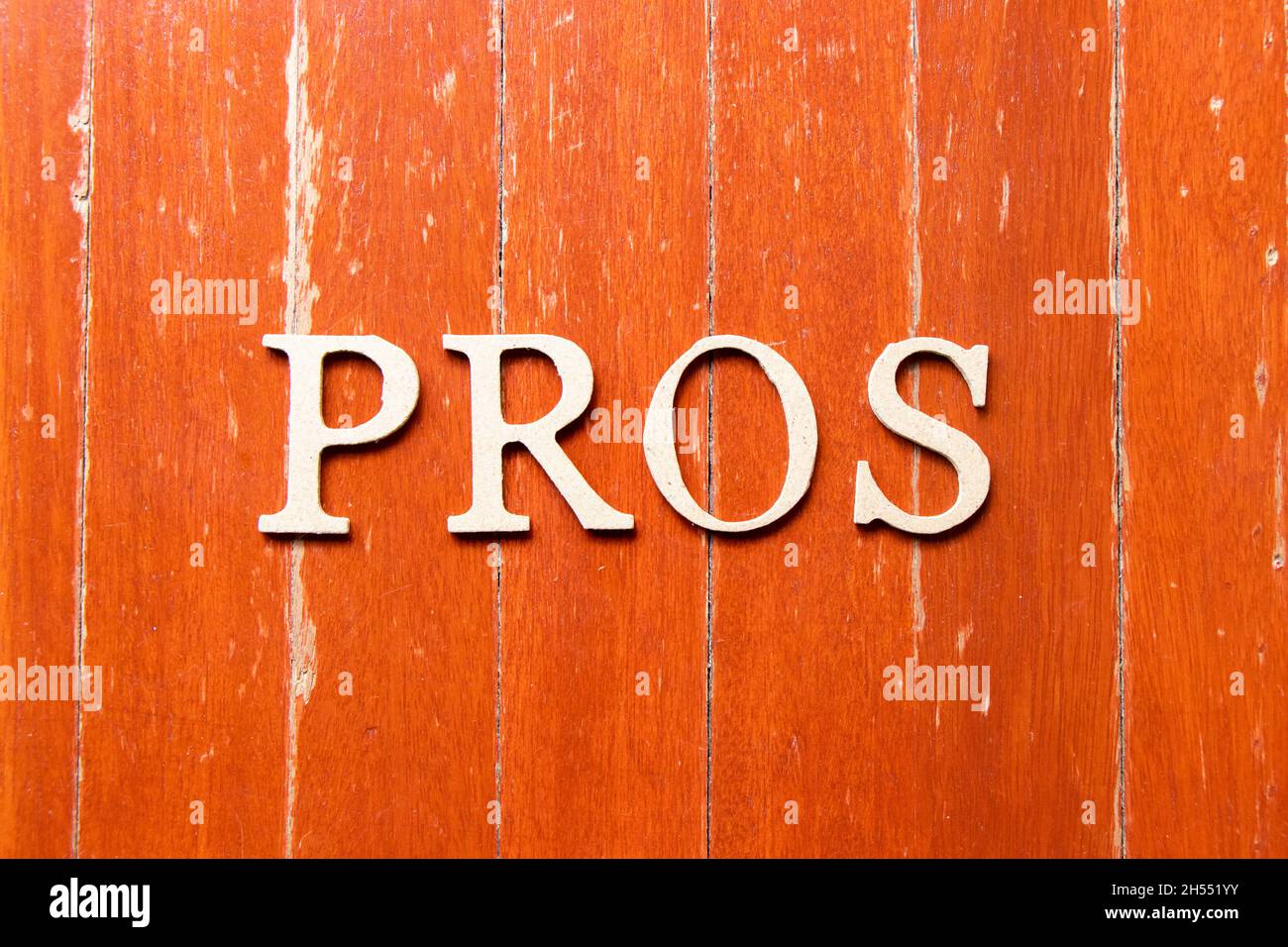 Alphabet letter in word pros on old red color wood plate background ...