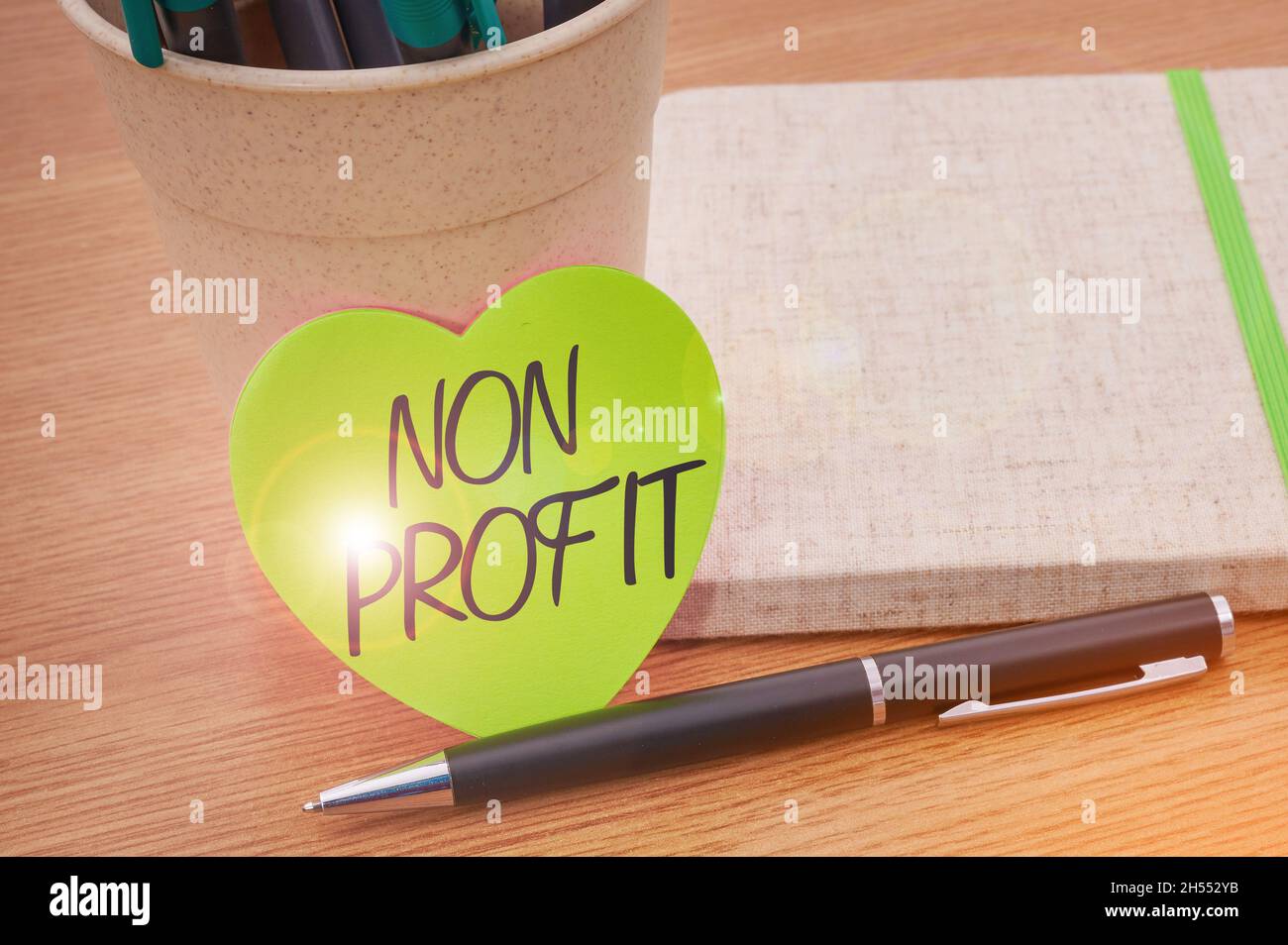 Hand writing sign Non Profit. Word Written on type of organization that ...