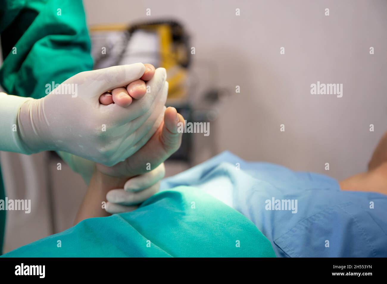 Hands of doctor holding with patient for encourage and trust at ...