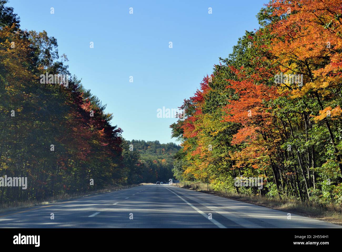Hooksett, New Hampshire, USA. A highway splices through a forest as ...