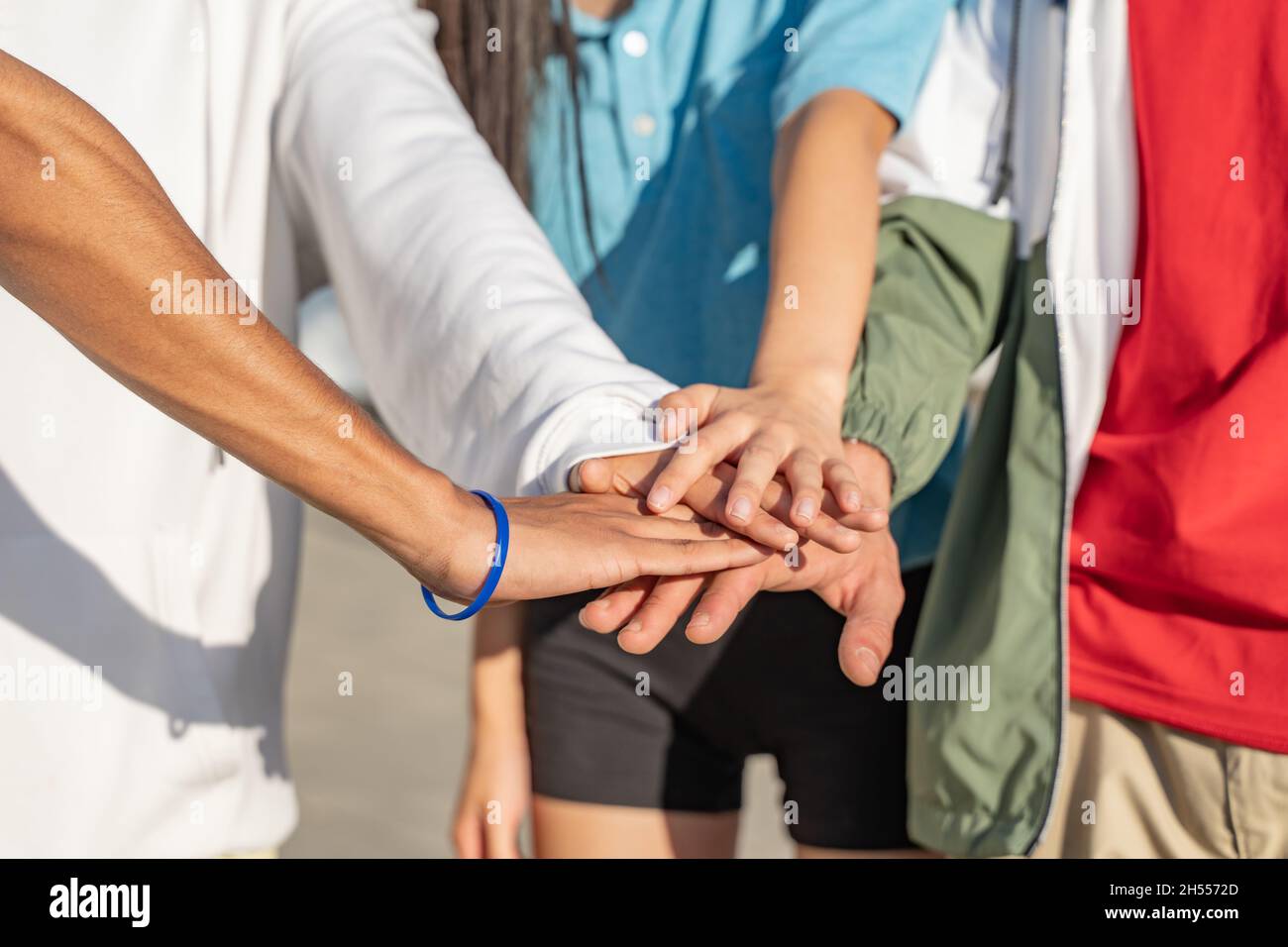 College student teamwork stacking diverse hand togetherness concept ...