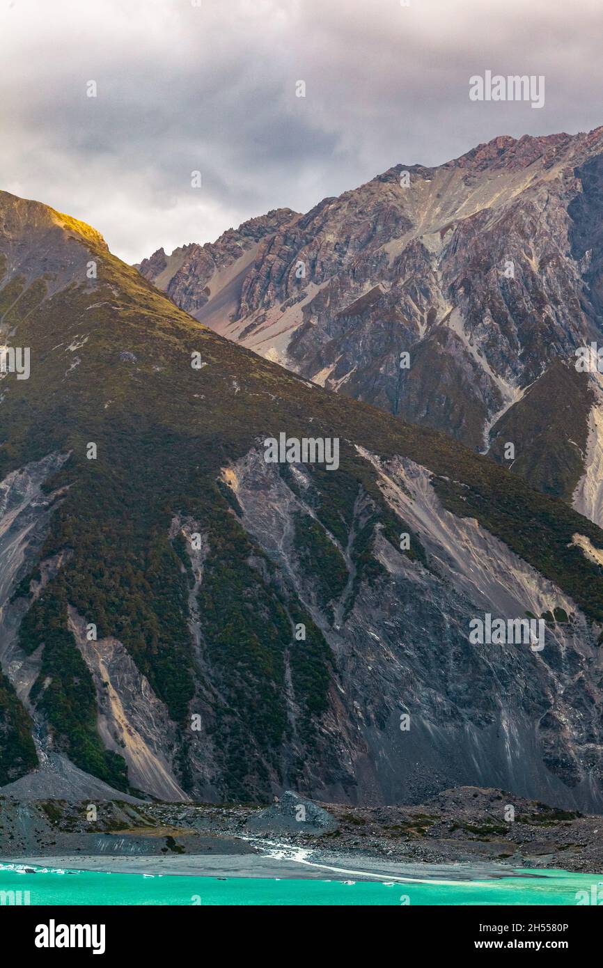 Steep cliffs over the lake. Lake Tasman. New Zealand Stock Photo - Alamy