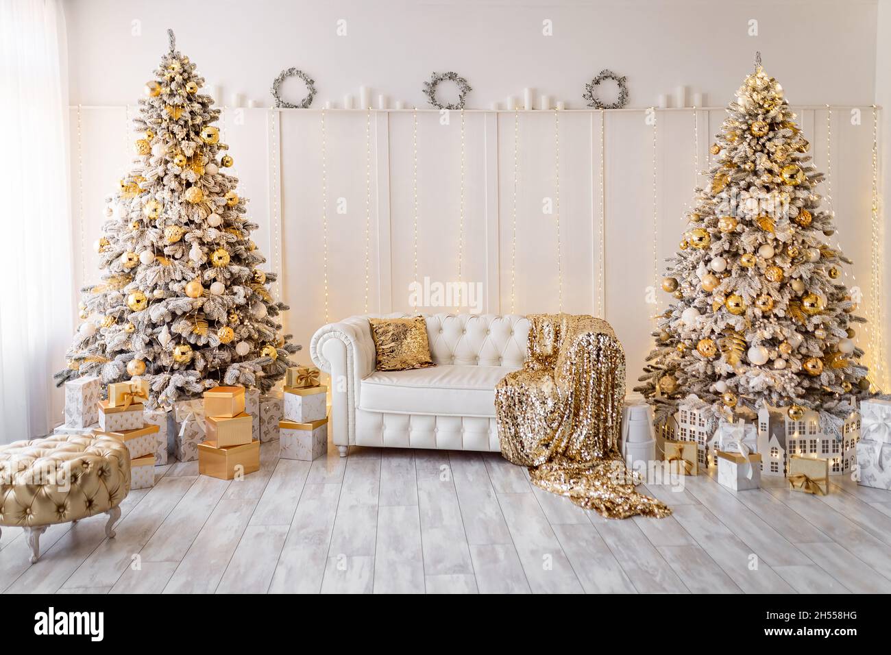 white modern christmas interior with new year trees decorated. Gold ...