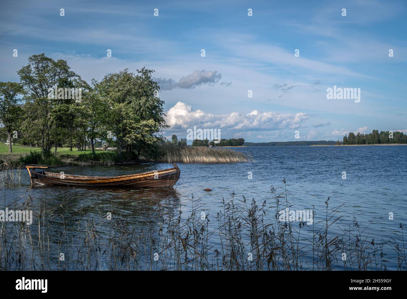 Picturesque view of a lonely boat and Onega lake from the shore of ...