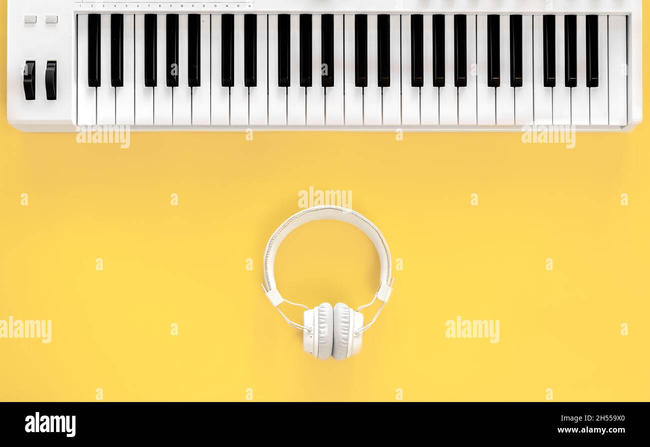 Musical flat lay background with headphones and musical keys Stock ...