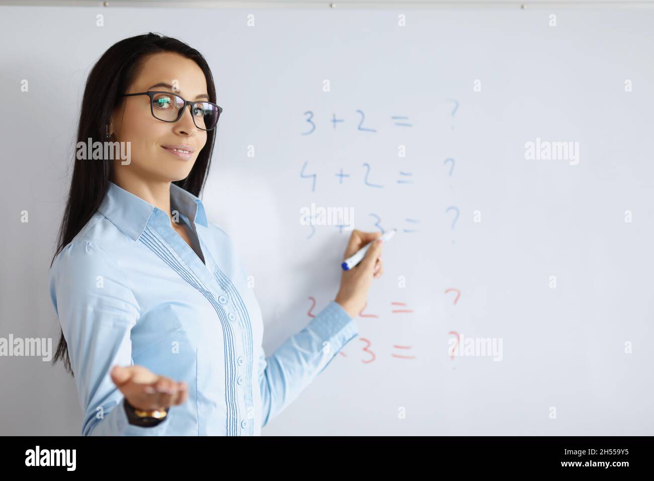 Smart tutor ask student question Stock Photo - Alamy