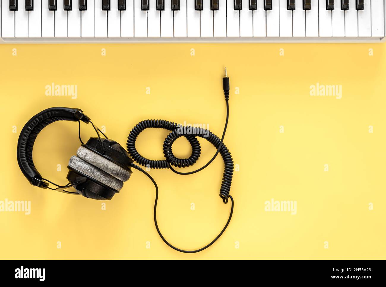 Musical flat lay background with headphones and musical keys Stock ...