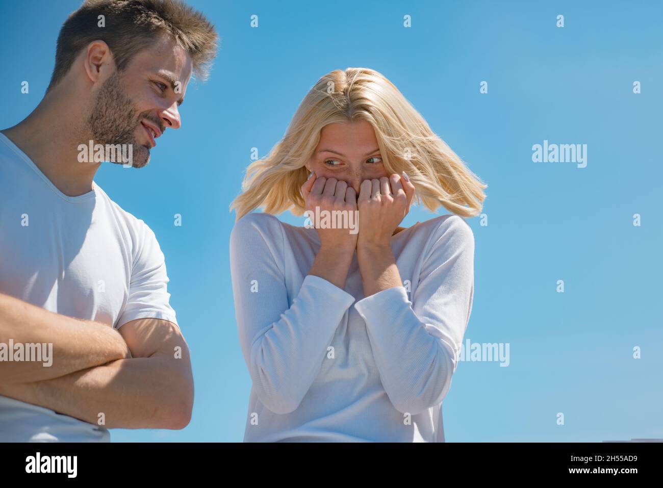 Young embarrassed lovers. Funny face. Declaration of love. Embarrassed ...