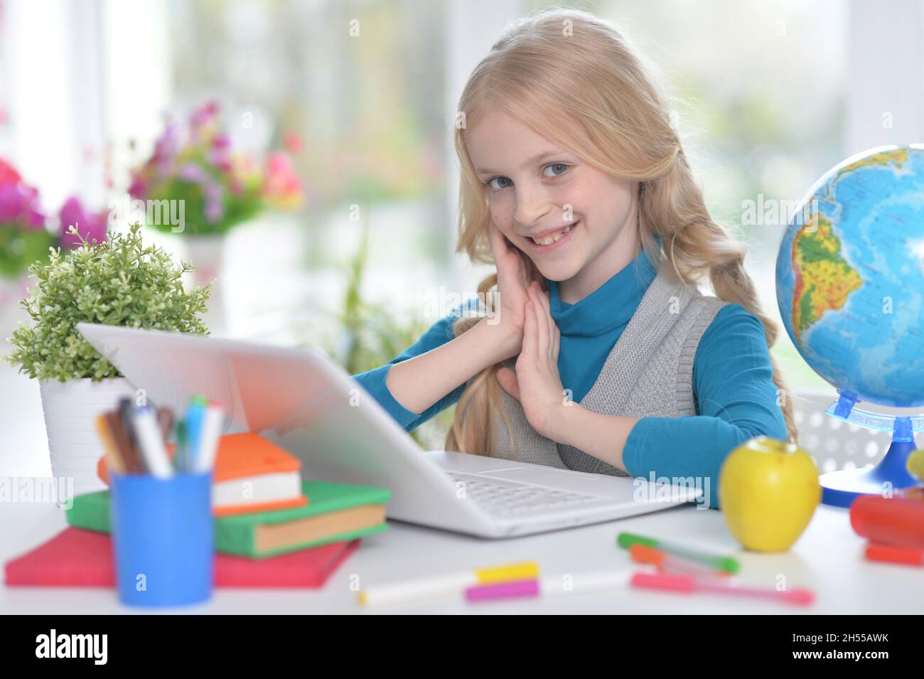 Portrait of beautiful young girl with laptop studying Stock Photo - Alamy