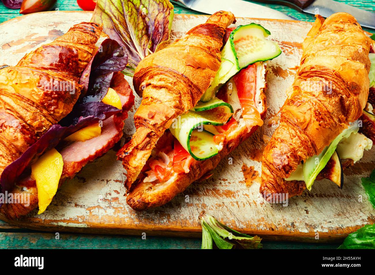 Fresh croissants with salted filling.Croissants with trout, meat bacon ...