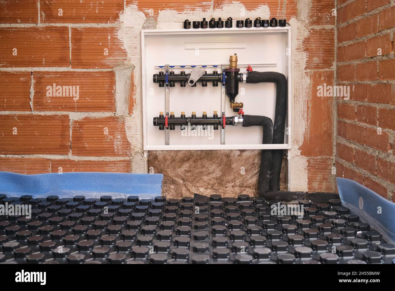 Radiant underfloor heating hydronic manifold Stock Photo - Alamy