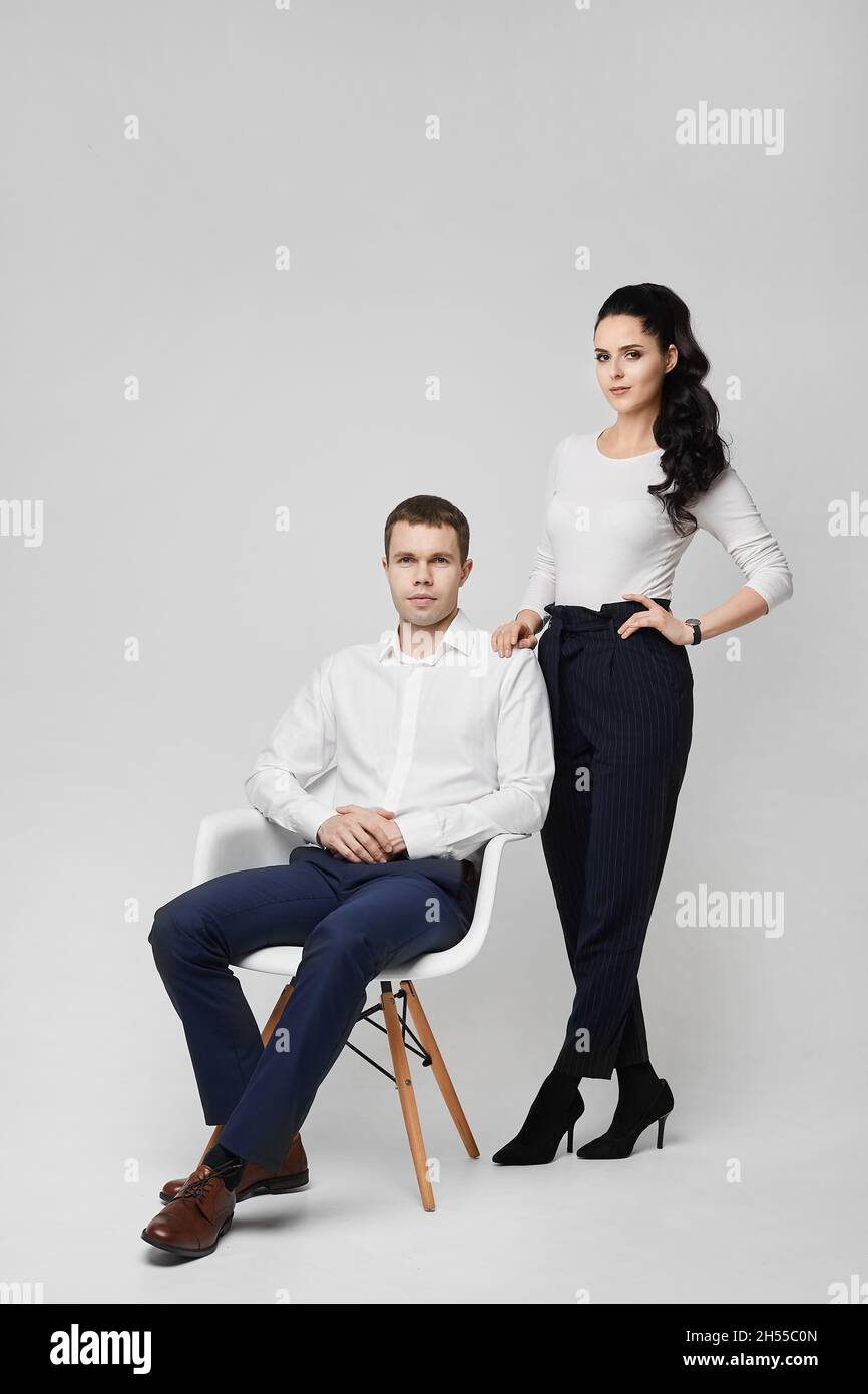 Fashionable colleagues in business, young confident man in formal ...