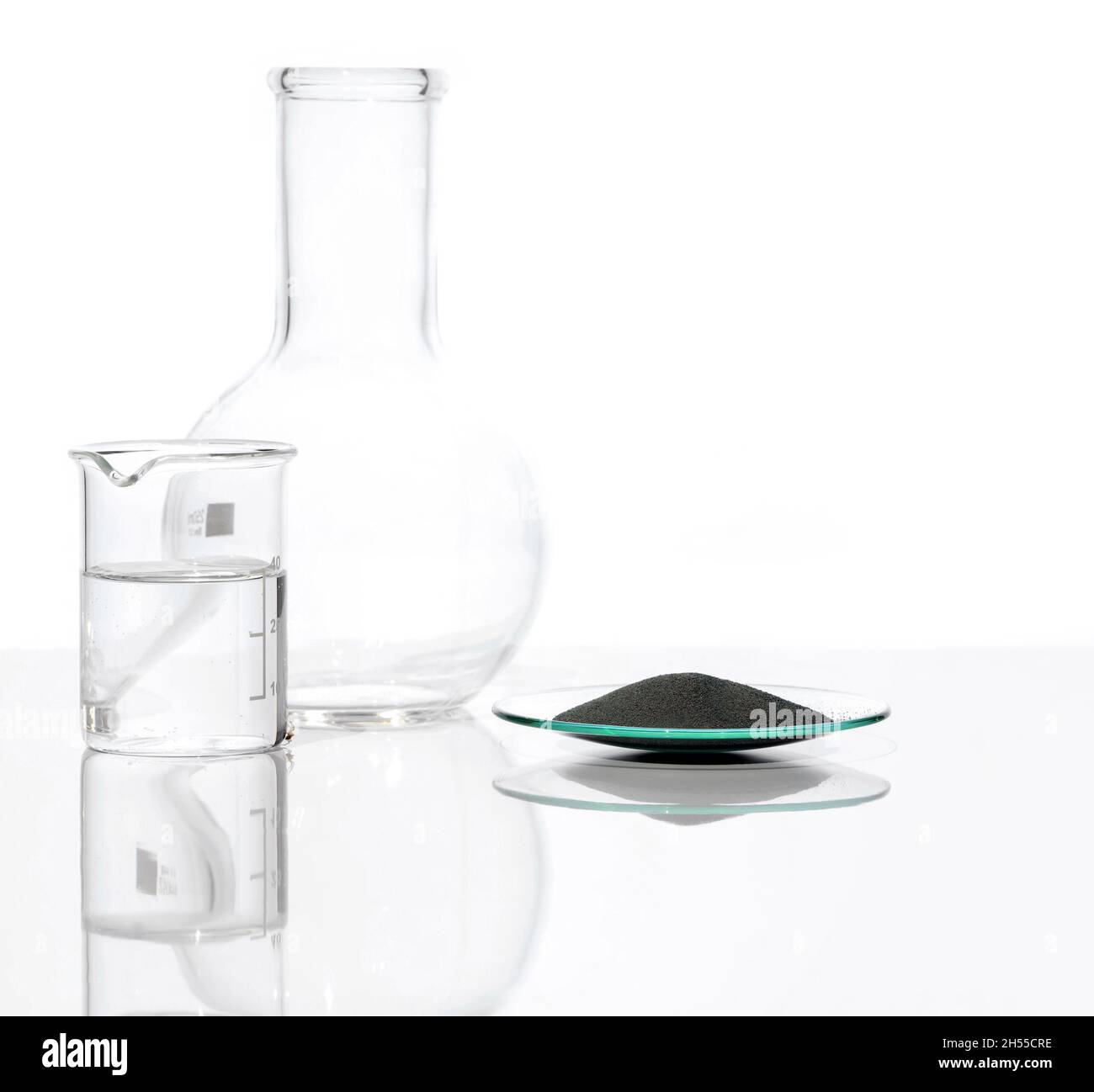 Zinc Powder in Chemical Watch Glass place next to crystal clear liquid ...