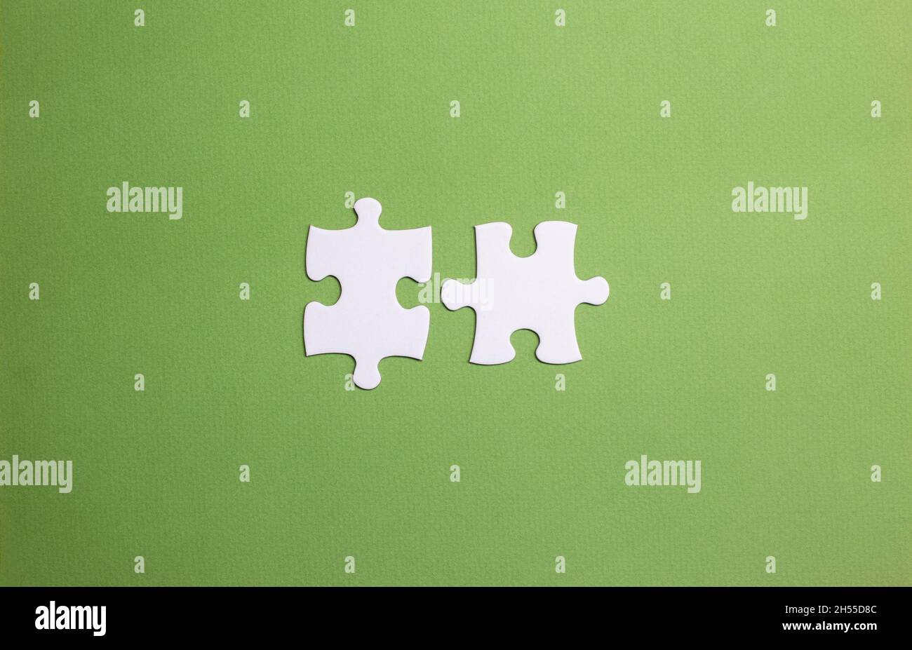 A two pieces of the puzzle about to connect. concept of union and ...